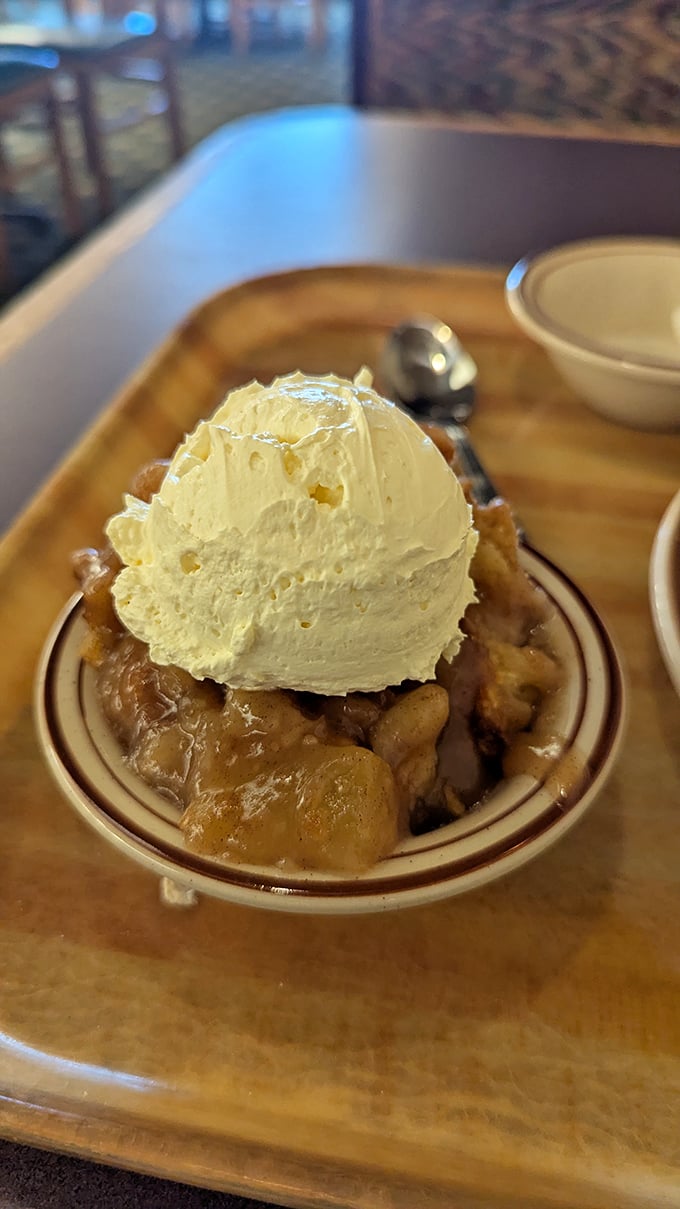 The apple cobbler topped with ice cream creates that perfect hot-cold romance that makes dessert the Shakespeare of the culinary world.