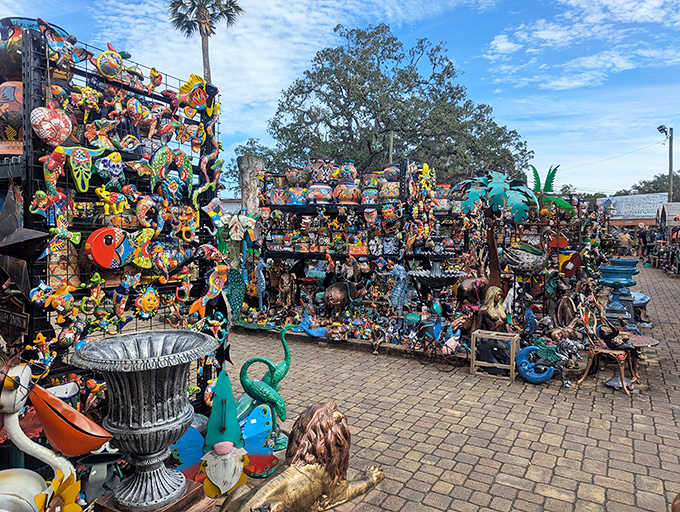 A dazzling wall of tropical-inspired art transforms an ordinary fence into an underwater carnival, where every square inch tells a different story.