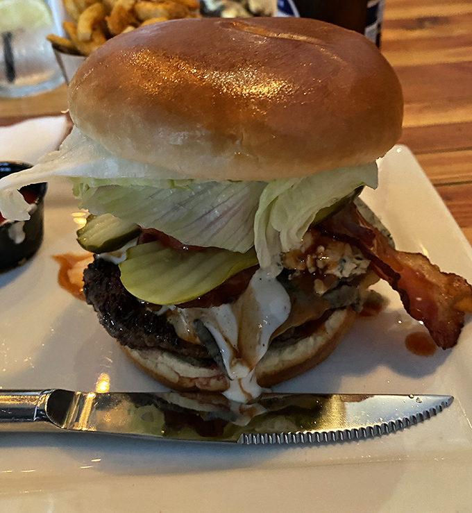 Behold the architectural marvel that is a properly built burger&mdash;layers of flavor stacked with the precision of a culinary engineer.