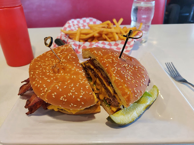 The bacon cheeseburger arrives like a beautiful, messy sonnet to simplicity&mdash;where every ingredient plays its part without unnecessary culinary jazz hands.