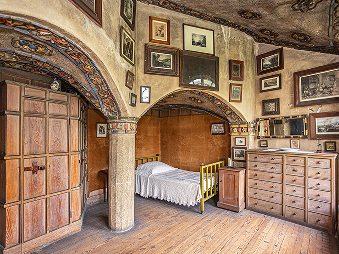 A bedroom that says, "Yes, I sleep surrounded by priceless artifacts and handcrafted tiles," as casually as most of us display family photos.