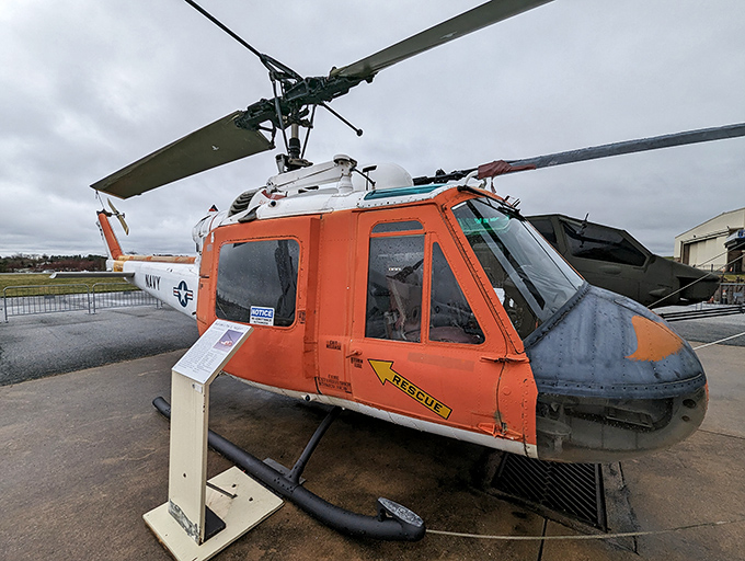 This Navy rescue helicopter's bright orange "RESCUE" marking isn't subtle, but when you're dangling from a cable above angry waves, subtlety isn't a priority.