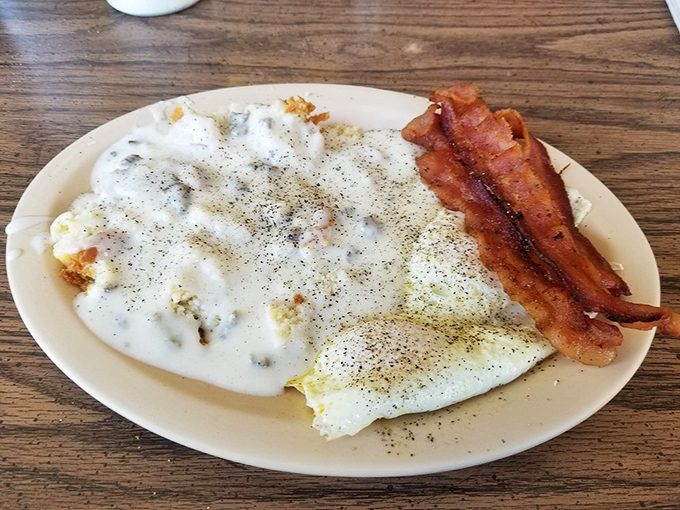 Biscuits and gravy that could settle family feuds – pillowy clouds of dough swimming in a peppery sea that would make any Southerner proud.