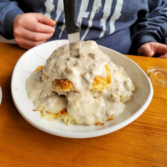 Biscuits and gravy so good they should require a permission slip. That pool of peppery gravy is where breakfast dreams come true.
