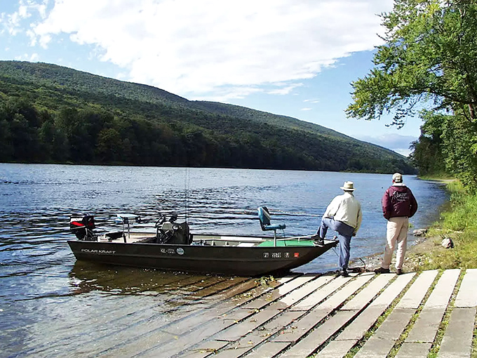 Two anglers prepare for a day on the water, proving that fishing isn't just about catching&mdash;it's about standing in places this beautiful while pretending to be patient.
