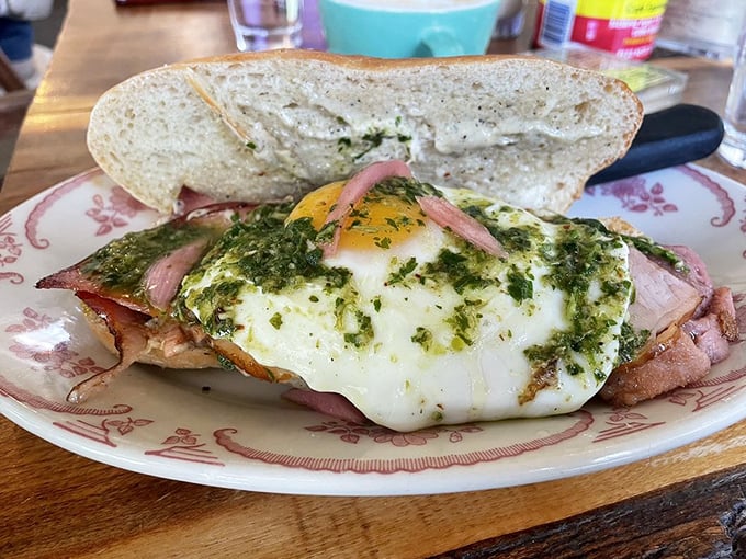 Breakfast sandwich or edible art installation? With that vibrant herb garnish and perfectly cooked egg, it's definitely both.