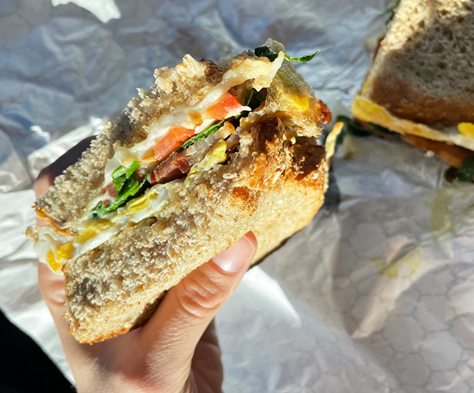 A sandwich that understands the importance of structural integrity&mdash;layers of fresh ingredients nestled between bread that's clearly overachieving in the best possible way.