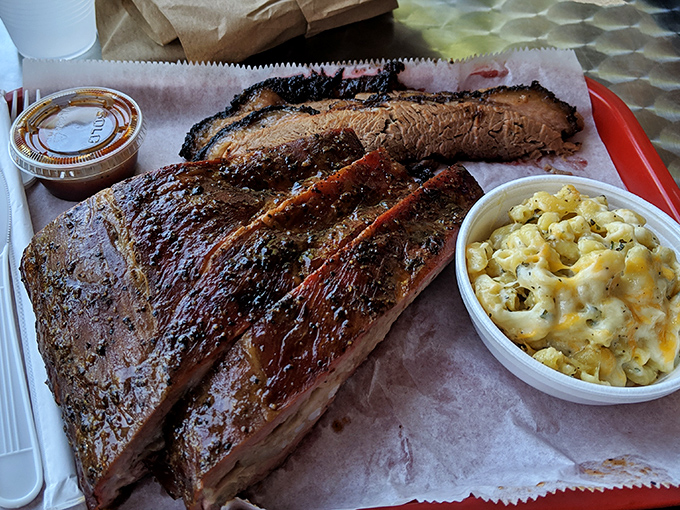 Brisket sliced thick enough to showcase the smoke ring that makes pitmasters weep tears of pure joy.