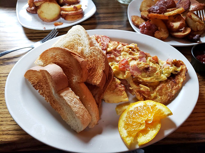 Toast so perfectly golden it belongs in Fort Knox, alongside eggs that clearly graduated from free-range university with honors.