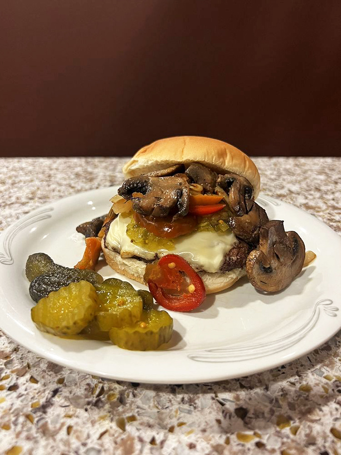 This isn't just a burger; it's a towering monument to everything that makes comfort food absolutely irresistible.