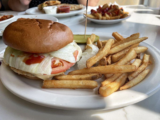 A burger so perfectly constructed, it practically poses for its own magazine cover shoot effortlessly.