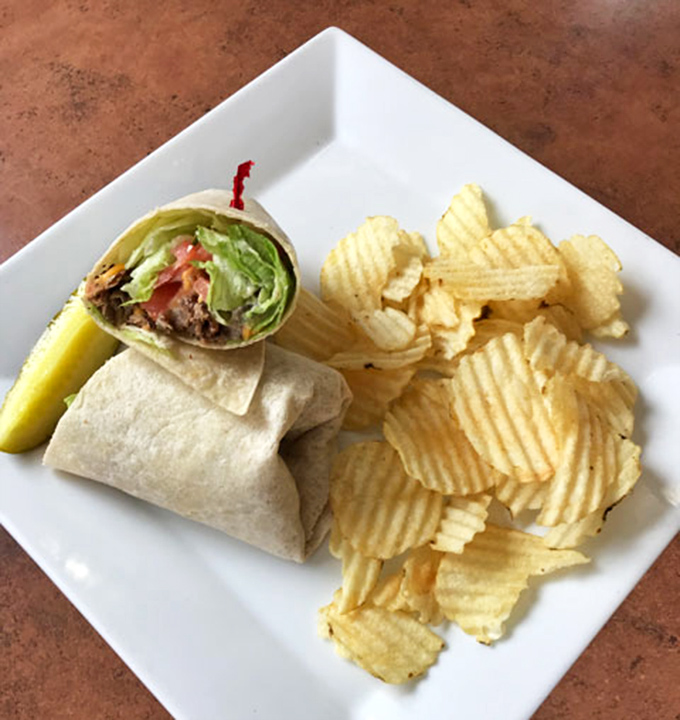 This isn't just a wrap&mdash;it's breakfast's answer to a hug, bundled with care and served with chips that crunch like morning optimism.