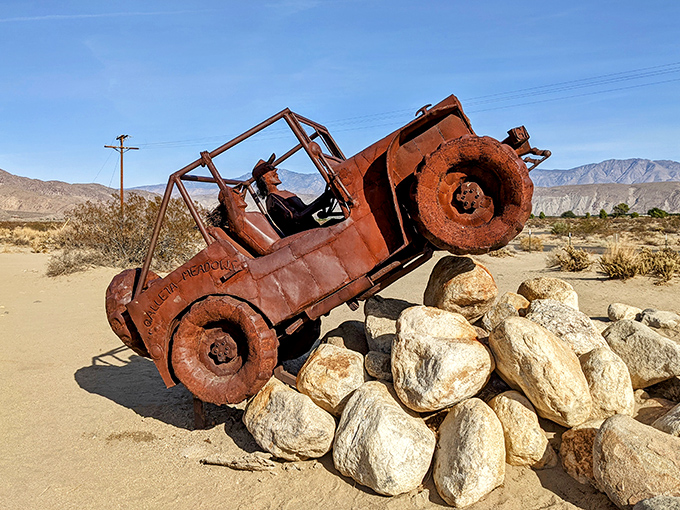 Off-roading for eternity! This rusted jeep sculpture perfectly captures the adventurous spirit of desert exploration, perpetually climbing over rocky terrain.