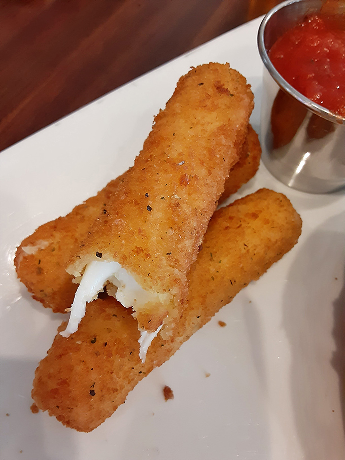 Golden cheese sticks arrive perfectly crispy, proving even the simplest pleasures deserve expert execution here.