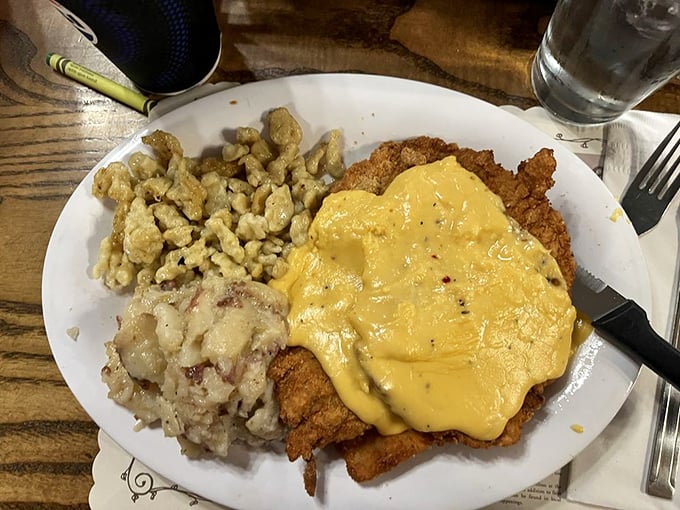 Schnitzel so perfectly golden it deserves its own Olympic medal, topped with cheese sauce and served with spaetzle that would make any Oma proud.