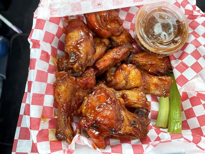These wings aren't playing around &ndash; glazed to sticky perfection and arranged like a delicious mosaic on that classic red-checkered paper.