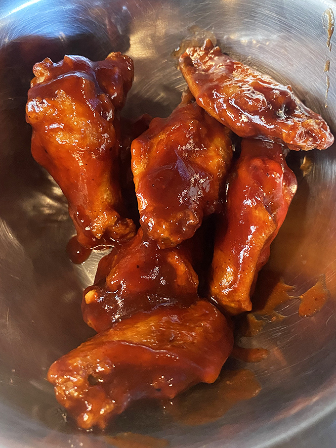 Wings so perfectly glazed they could hang in the Louvre. The sauce-to-meat ratio here is what mathematicians call "the golden delicious ratio."