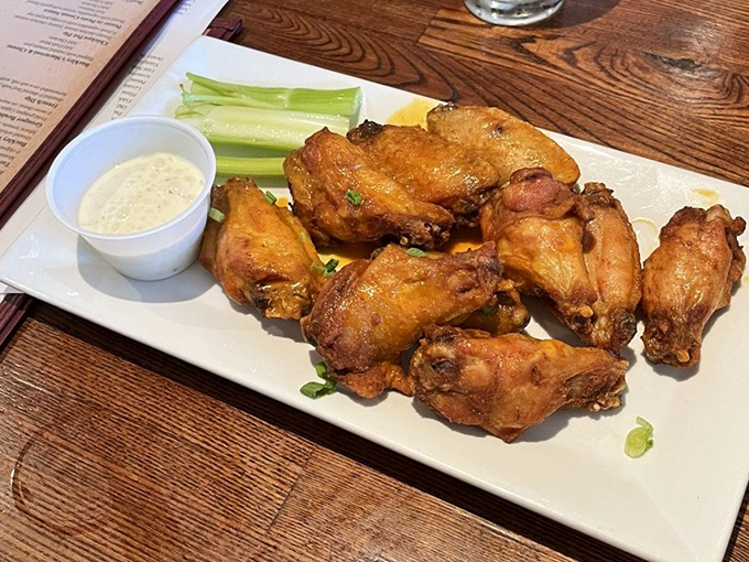 These aren't just wings; they're crispy vessels of flavor that make you wonder if chickens in Delaware have some special arrangement with the culinary gods.