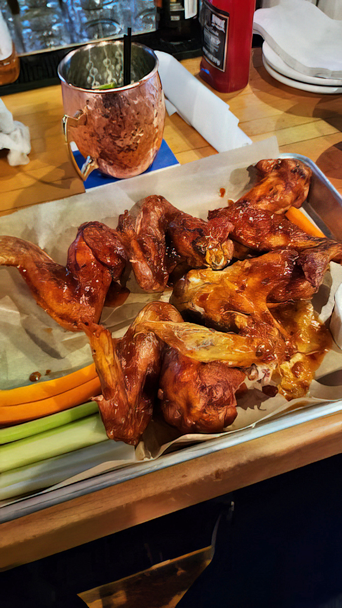 Glistening wings that have clearly been on a spiritual journey through smoke and fire, served with celery sticks that nobody will remember were there.