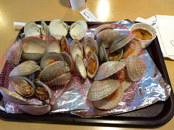 A mountain of fresh clams ready for their moment of glory. Like nature's little treasure chests, each one holds a briny surprise worth savoring.