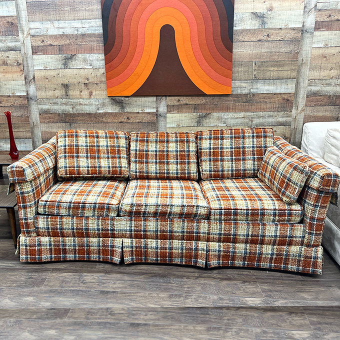 That plaid sofa has seen things. Probably the moon landing, definitely "The Brady Bunch," and possibly your parents' first date.