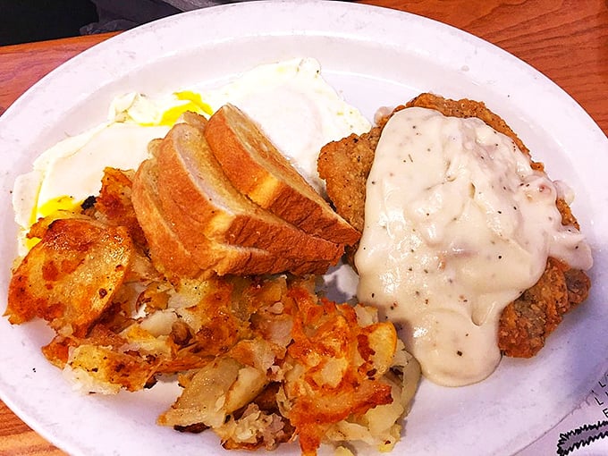 Country fried steak smothered in creamy gravy alongside eggs and home fries&mdash;the breakfast equivalent of hitting the comfort food jackpot.