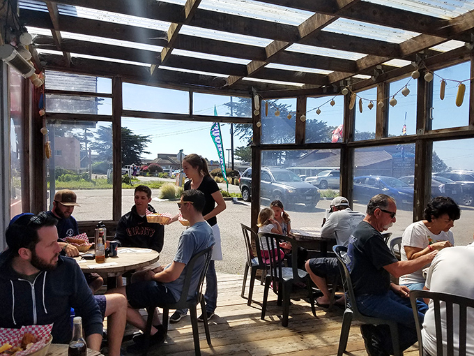 Sunlight streams through windows as families gather over seafood feasts. Notice nobody's looking at their phones – that's the power of fresh fish.
