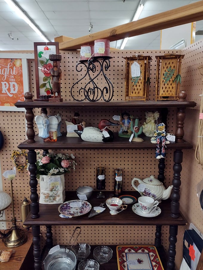 Decorative items that tell stories without saying a word. This carefully arranged shelf offers the perfect conversation pieces for homes that speak volumes about their owners.