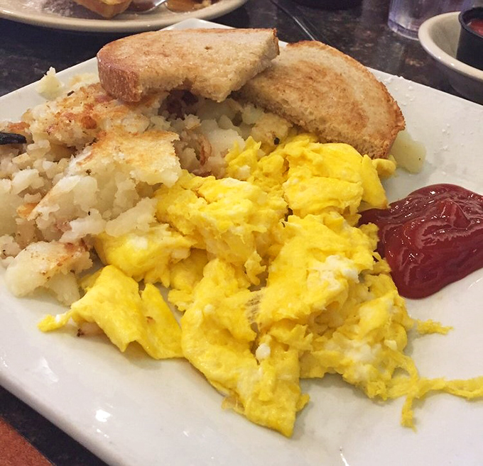 Scrambled eggs that actually taste like eggs, home fries with that perfect crisp-tender balance, and toast standing by for cleanup duty.