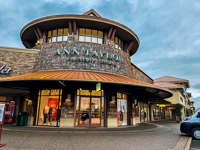 Ann Taylor's circular storefront stands like a fashionable lighthouse, guiding lost shoppers toward professional attire that won't break the bank.