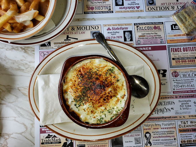 French onion soup with a cheese pull that deserves its own Olympic medal. The crouton-to-broth ratio? Absolute perfection.
