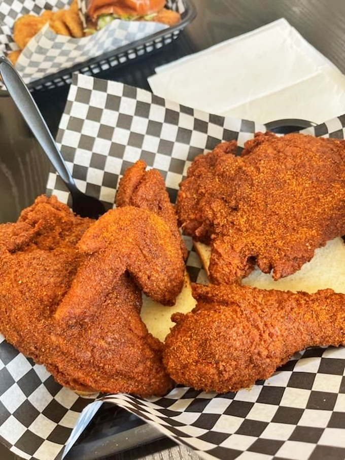Nashville-style hot chicken with a crust so perfect it should be in a museum. That red coating isn't just color&mdash;it's a promise.
