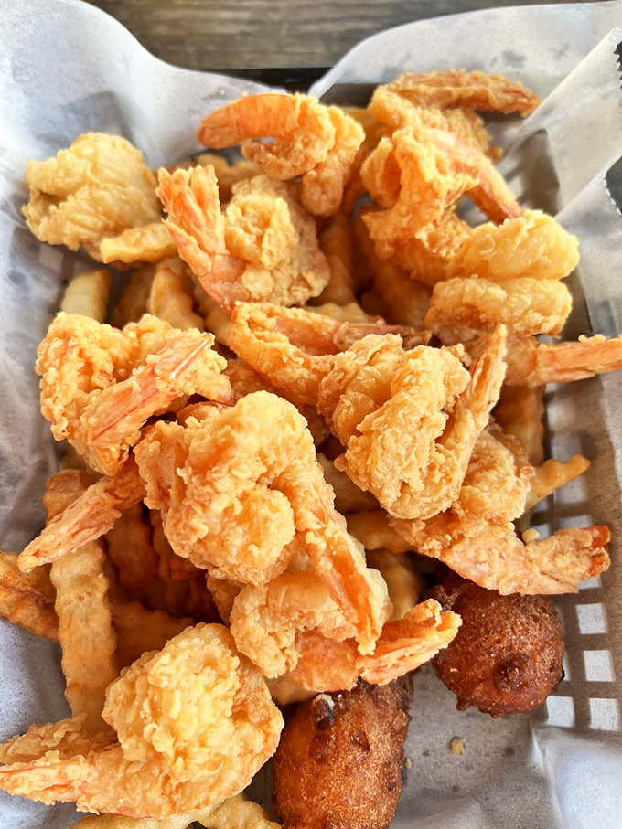 Fried shrimp and hush puppies &ndash; a basket of Gulf goodness where each golden morsel delivers that perfect crunch-to-sweetness ratio.