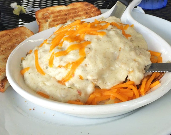 This isn't just gravy&mdash;it's a warm, savory blanket lovingly tucked around shredded cheese and potatoes. Comfort food that hugs you back.