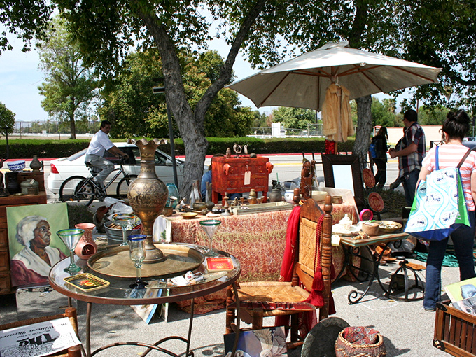 Mid-century modern meets bohemian eclecticism under the shade of California oaks. That coffee table has seen more history than most history books.