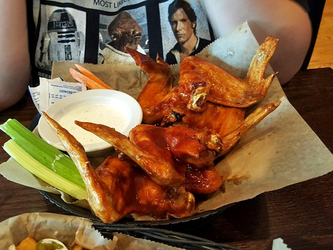 Wings so perfectly glazed they deserve their own museum exhibit: "Still Life With Buffalo Sauce and Blue Cheese Dressing."