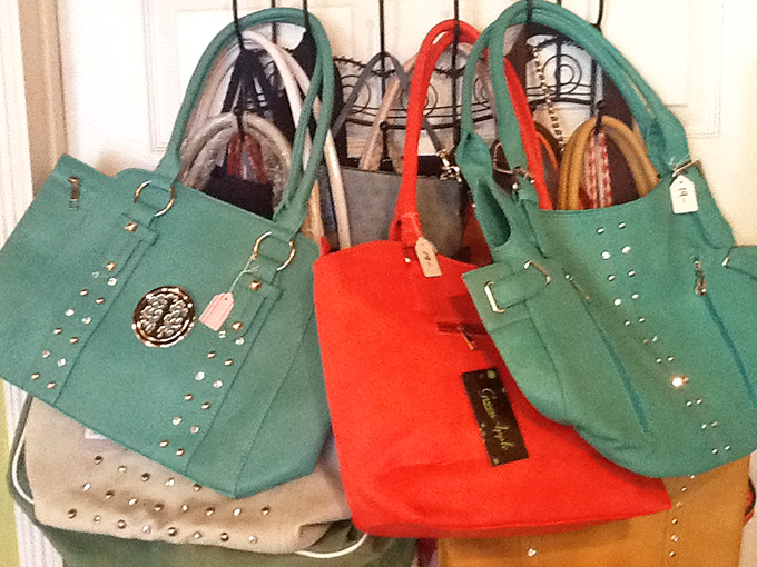 Handbag heaven in teal and coral – structured purses with tags still attached prove that secondhand style doesn't mean sacrificing fashion.