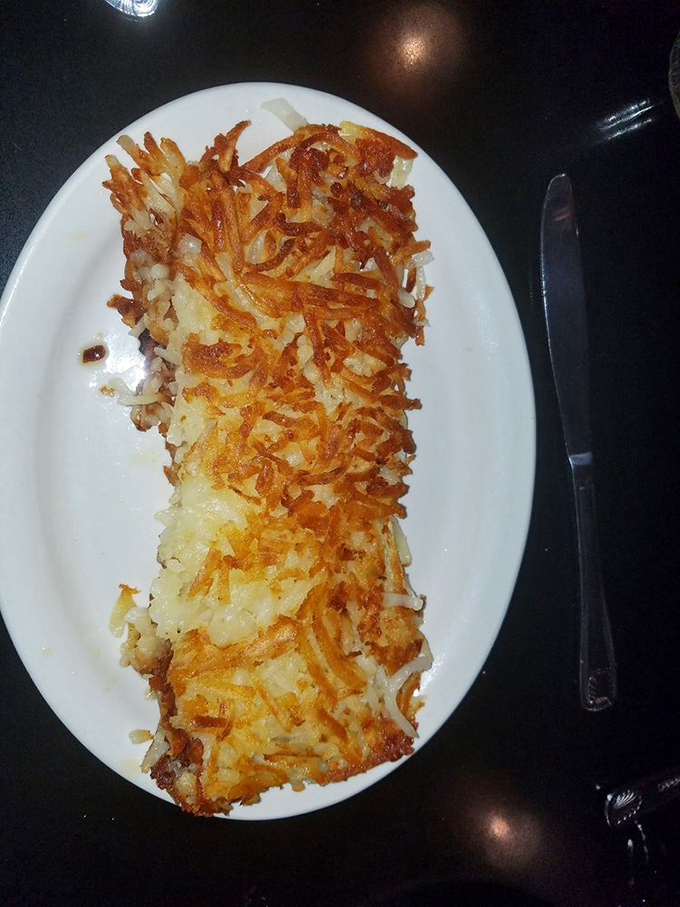 Golden-brown hash browns that crackle with each bite. The exterior achieves that perfect crisp while hiding tender potatoes beneath.