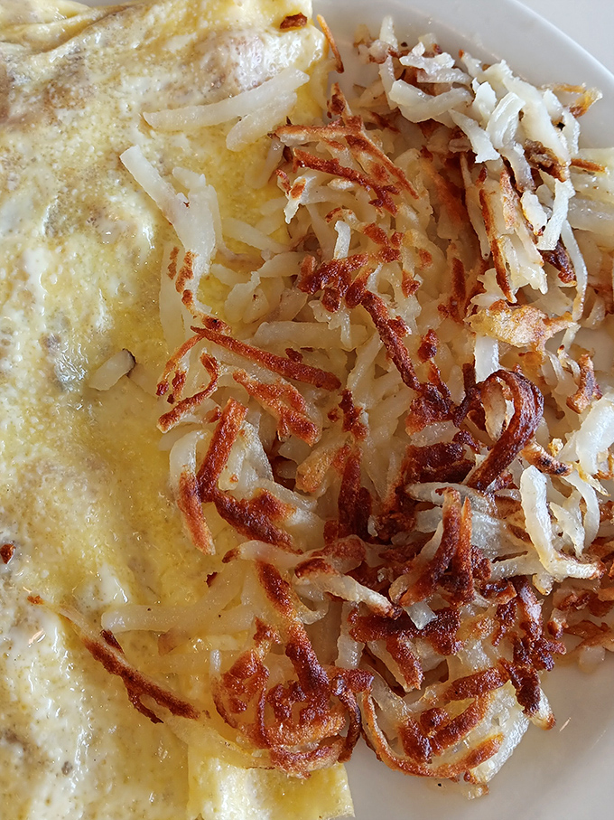 Hash browns so perfectly crispy they deserve their own Instagram account. The golden-brown edges crackle with promises of potato perfection.