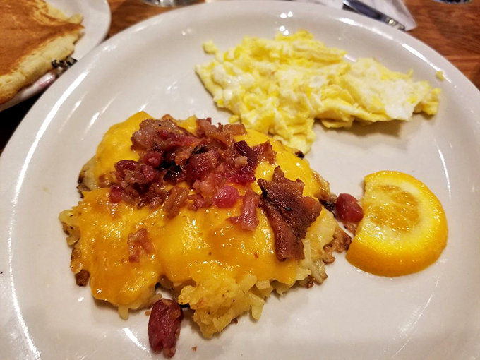 Hashbrown casserole topped with melted cheese and bacon – because potatoes deserve to dress up fancy sometimes too.