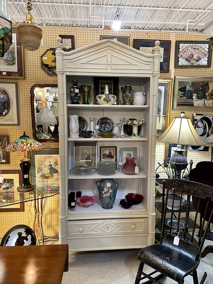This elegant white bookcase isn't just furniture &ndash; it's a stage where porcelain, glassware, and memories perform their silent theater of nostalgia.