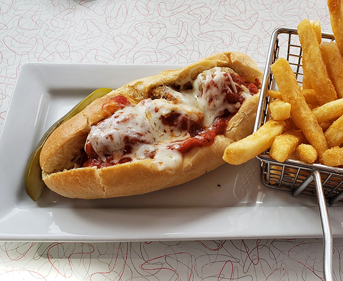 This isn't just a sandwich&mdash;it's architectural perfection where melted cheese meets marinara in a dance as old as Route 66 itself.