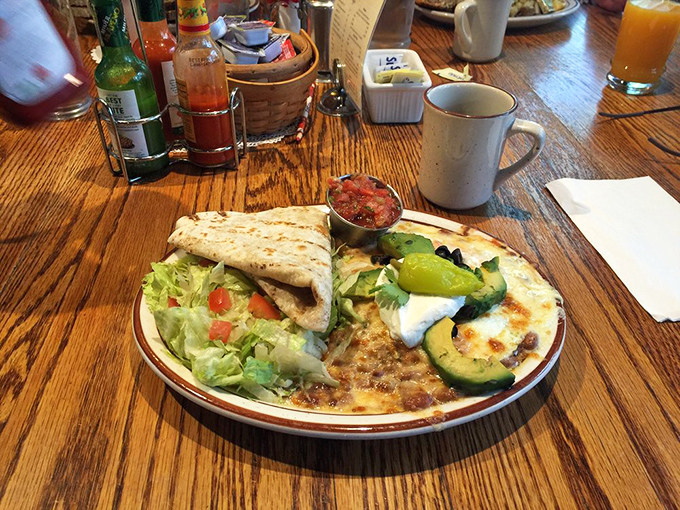 Not your average breakfast plate. This colorful fiesta of flavors combines crispy tortillas, fresh avocado, and eggs for a morning masterpiece.
