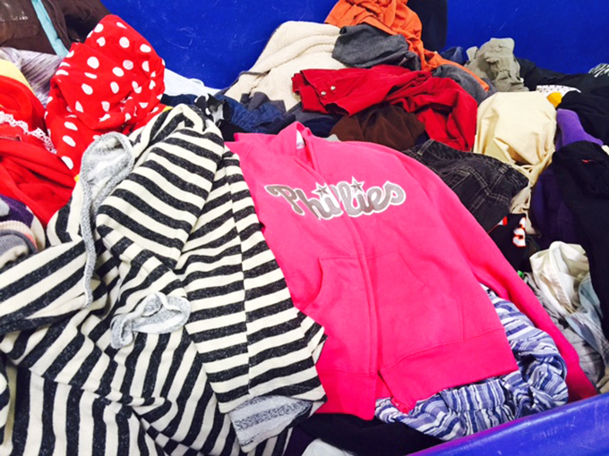 A kaleidoscope of colors and patterns where yesterday's closet cleanouts become tomorrow's fashion statements. Spot the pink Phillies jacket waiting for its comeback tour.