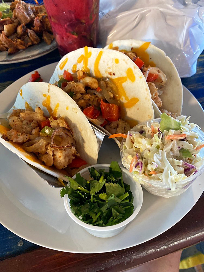 Tacos that don't need a passport to deliver authentic flavor. That fresh cilantro and slaw are the supporting actors who steal the show. 