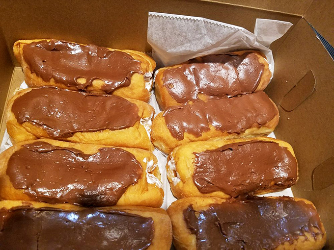 Long johns lined up like sweet soldiers, each one a testament to traditional bakery excellence.
