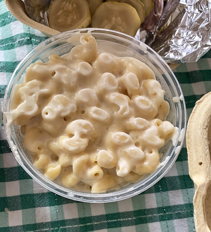 The famous Gouda Mac N Cheese in all its creamy glory. Each pasta curl wrapped in a velvety cheese embrace that makes ordinary mac and cheese weep with inadequacy.