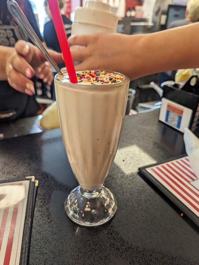 Sprinkles on top aren't just decoration&mdash;they're confetti celebrating this thick, creamy milkshake that requires serious straw commitment and zero regrets.