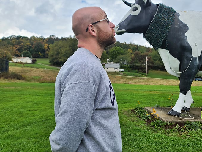 The universal language of roadside attractions: grown adults posing with giant fiberglass animals. Some traditions are too wonderful to ever outgrow.