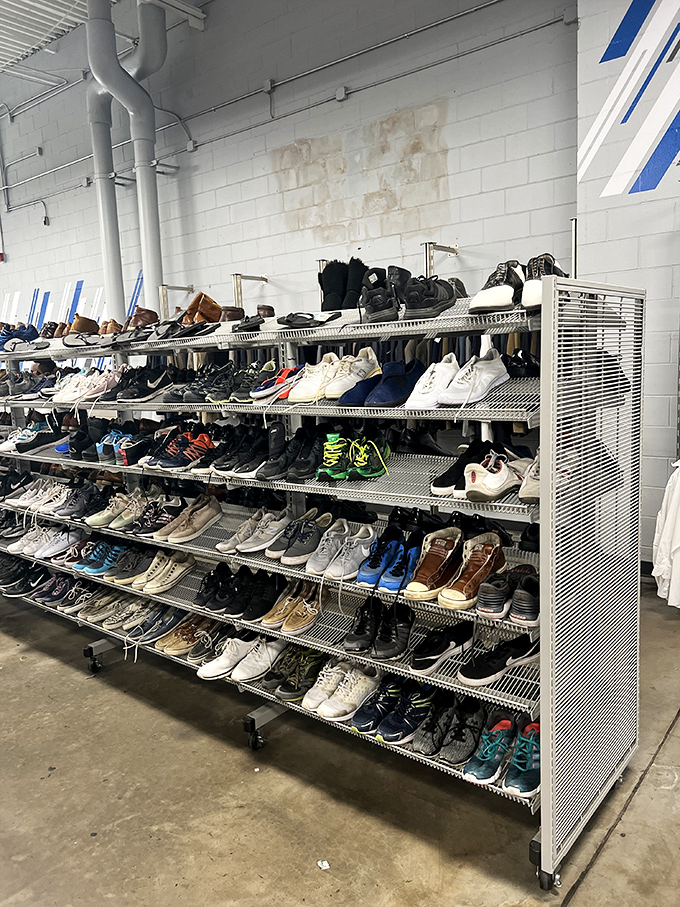 Men's footwear lined up like soldiers ready for inspection. That perfect pair of barely-worn Nikes? They're practically begging to come home with you.